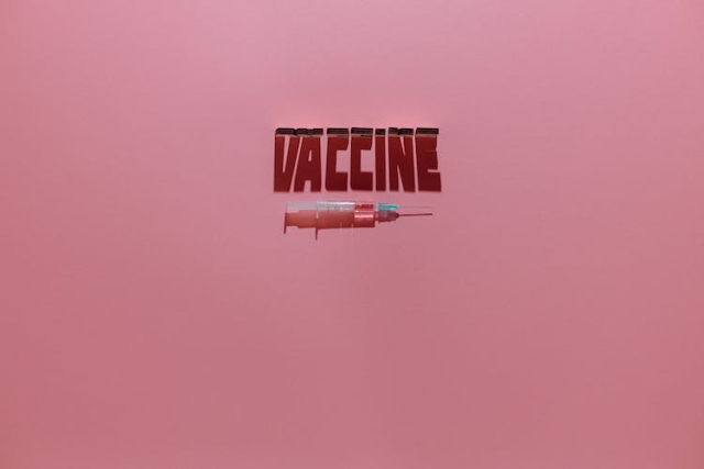 Free: A Syringe and Vaccine Lettering Text on Pink Background - nohat.cc