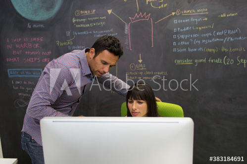 Free: Creative business people working at computer in front of ...