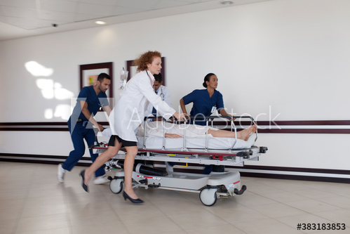 Free: Doctors and nurses rushing patient on stretcher in hospital ...