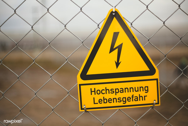 Free: High voltage warning sign hanging on a fence | Free public domain ...