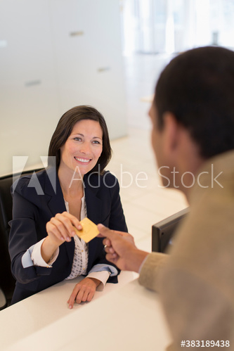 Free: Hotel receptionist taking credit card from businessman - nohat.cc