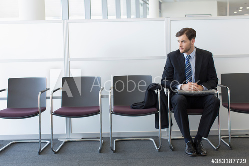 Free: Nervous young businessman waiting in office lobby - nohat.cc