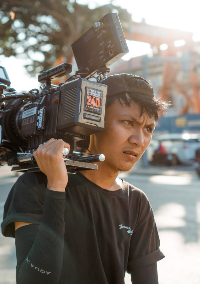 Free: Photo Of Man Carrying Camera Equipment - nohat.cc