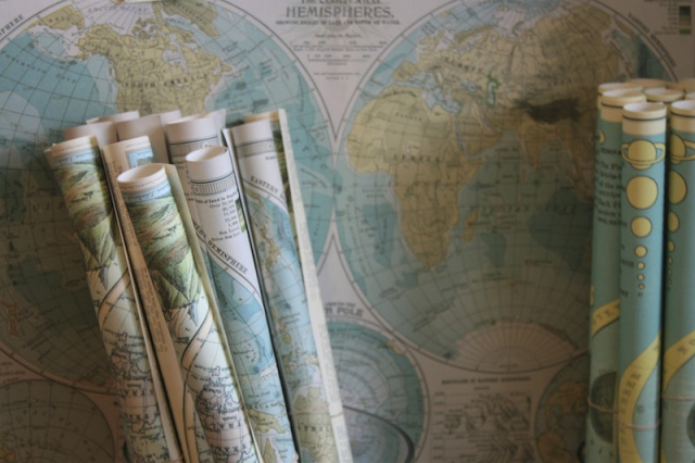 Free: Rolled maps standing against a world | Free Photo - rawpixel ...