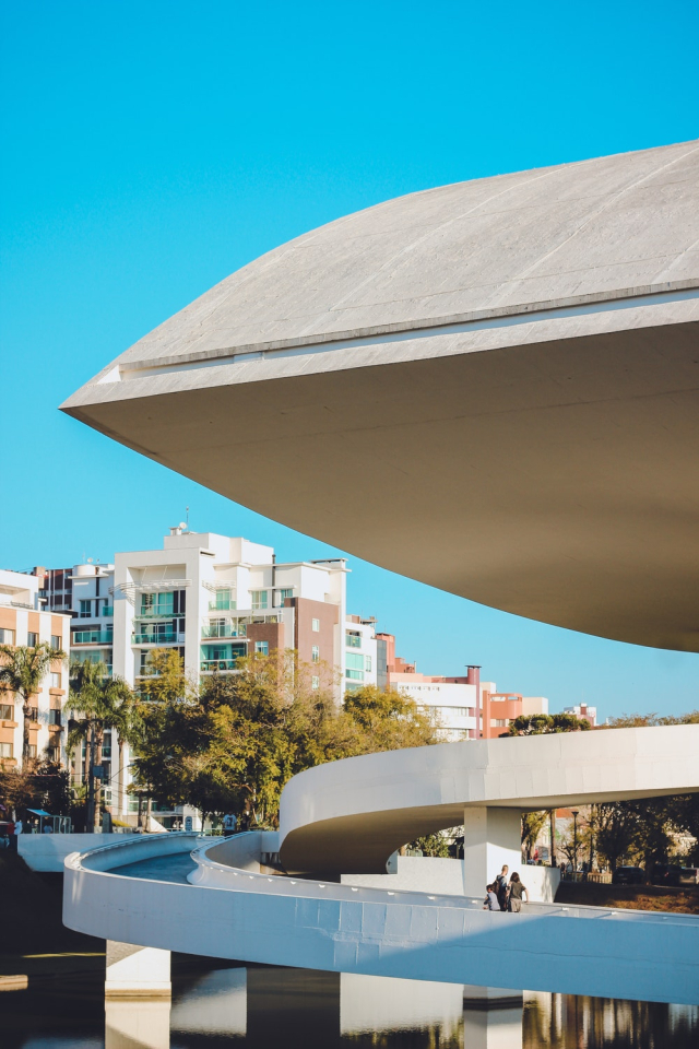 Free: White Flyover Near White Painted Building Under Blue Sky - nohat.cc