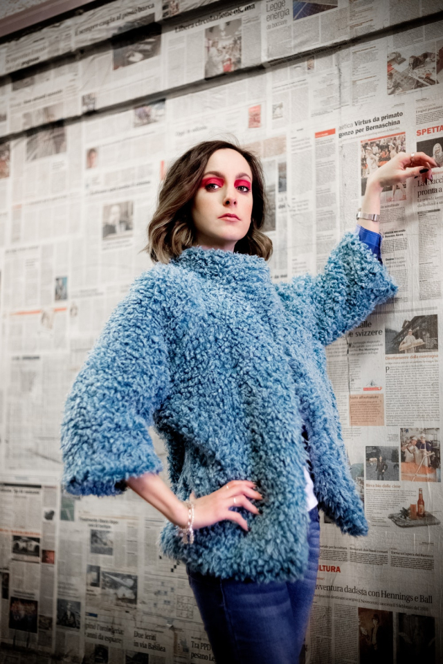 Free: Woman in Blue and White Coat and Blue Denim Jeans Holding Wall ...