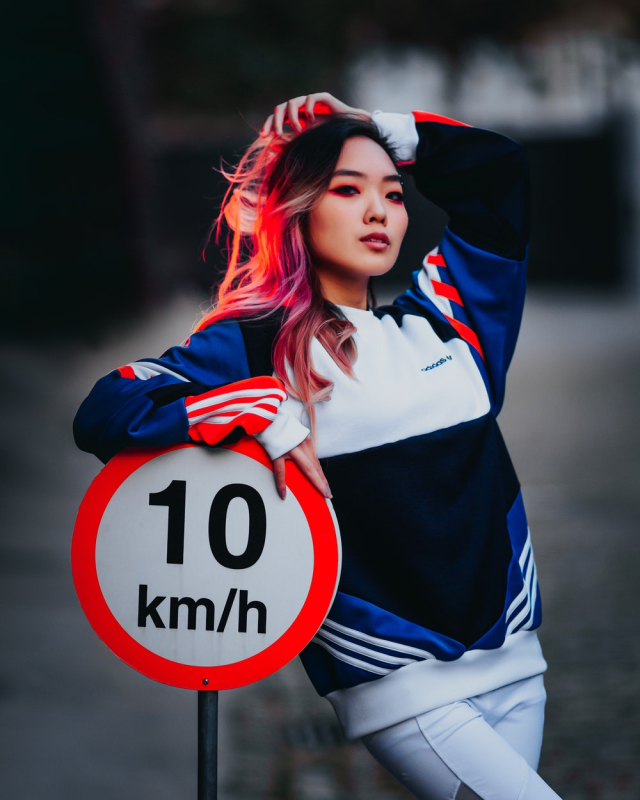 Free: Woman Leaning on 10 Km/h Signage - nohat.cc
