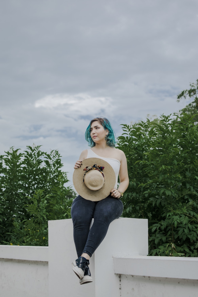 Free: Woman Sitting on White Column - nohat.cc