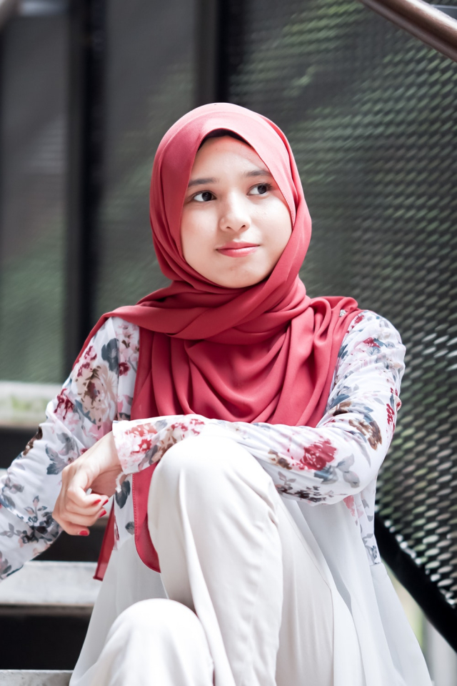 Free: Woman Wearing Red Hijab Sitting on Stairs - nohat.cc