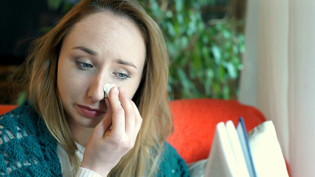 Free: Young girl crying while reading very sad book, steadycam shot ...